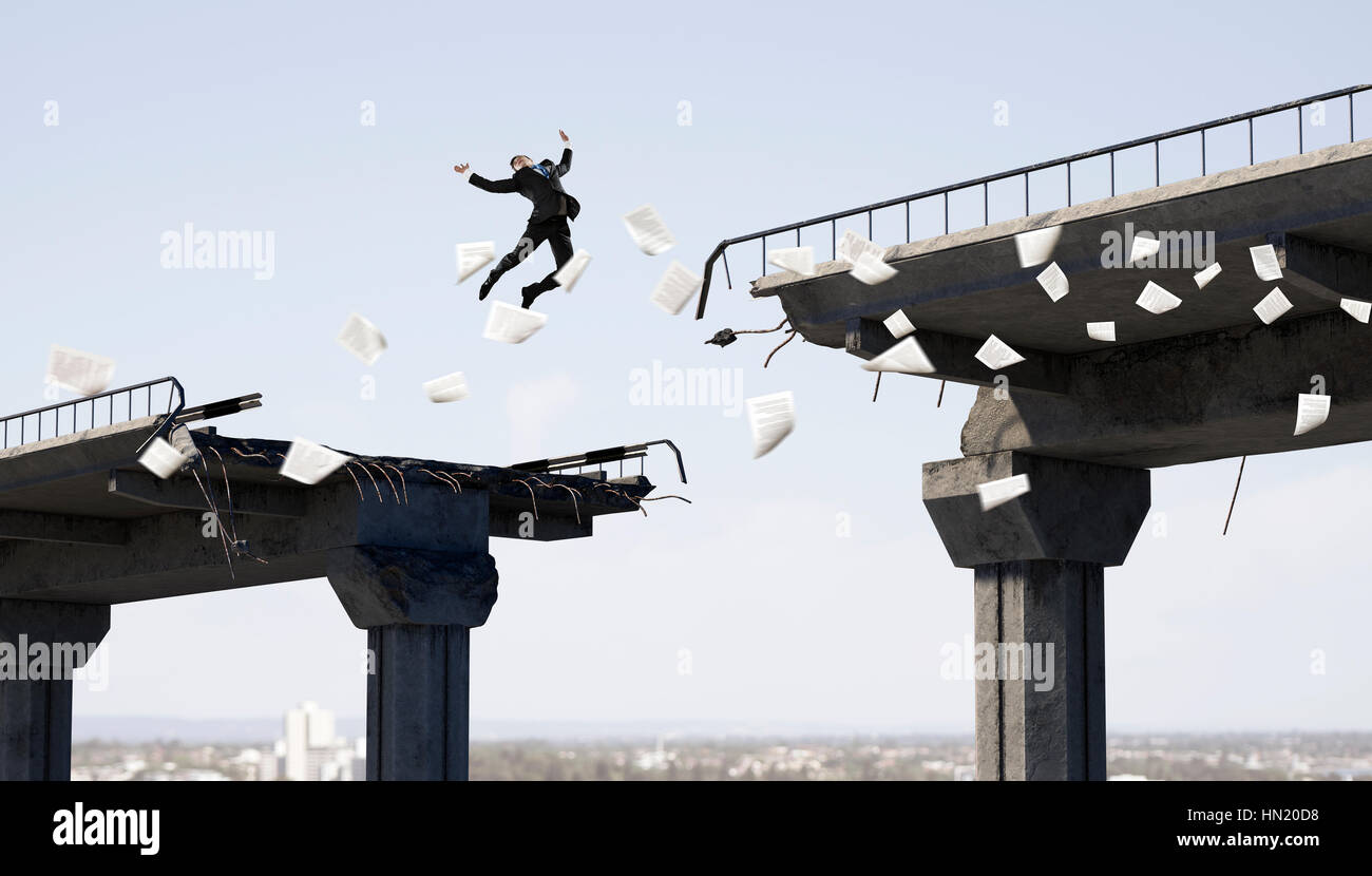 Businessman jumping over a gap in bridge as symbol of problem ...