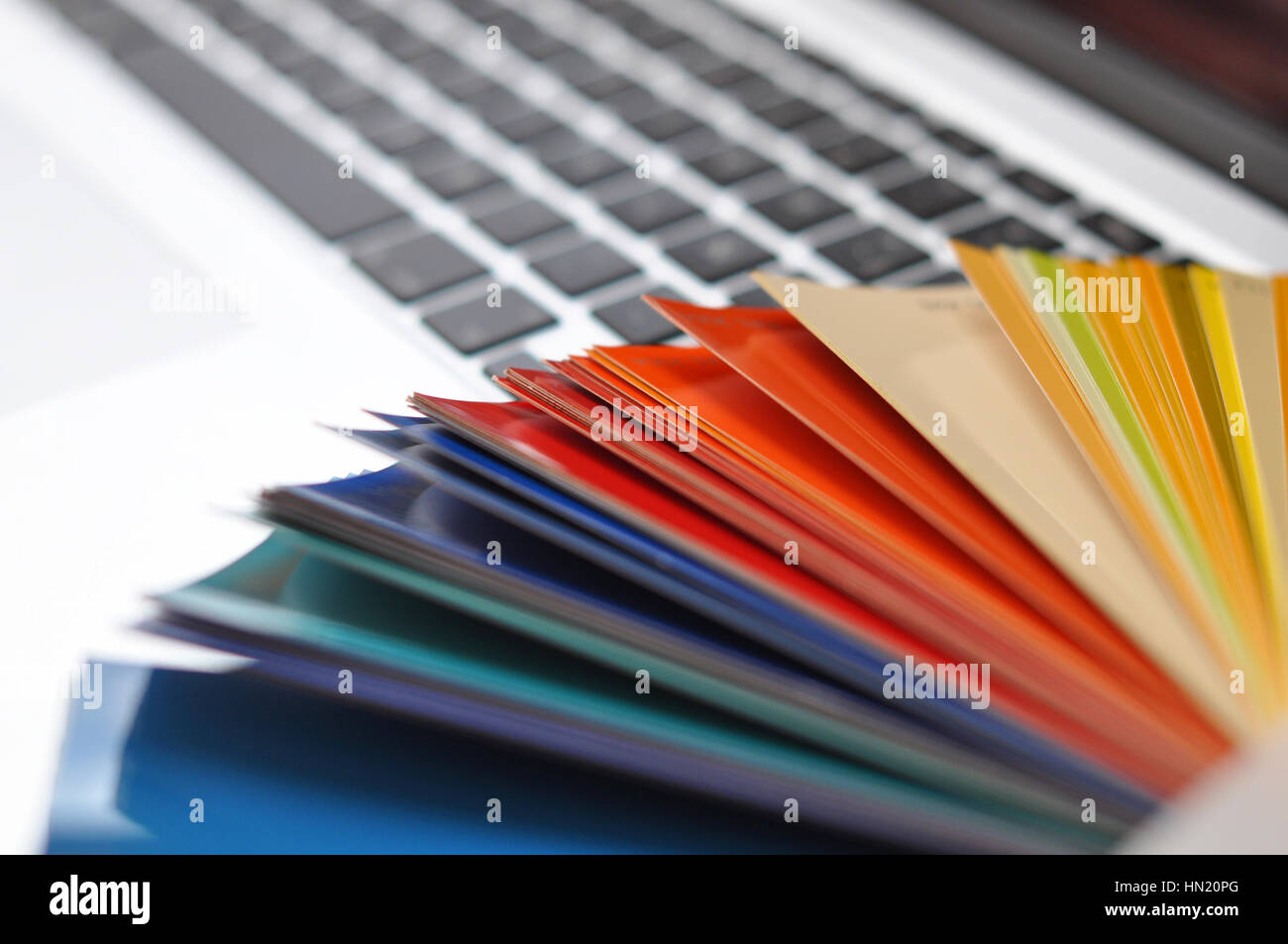 Color palette for design over a laptop Stock Photo - Alamy