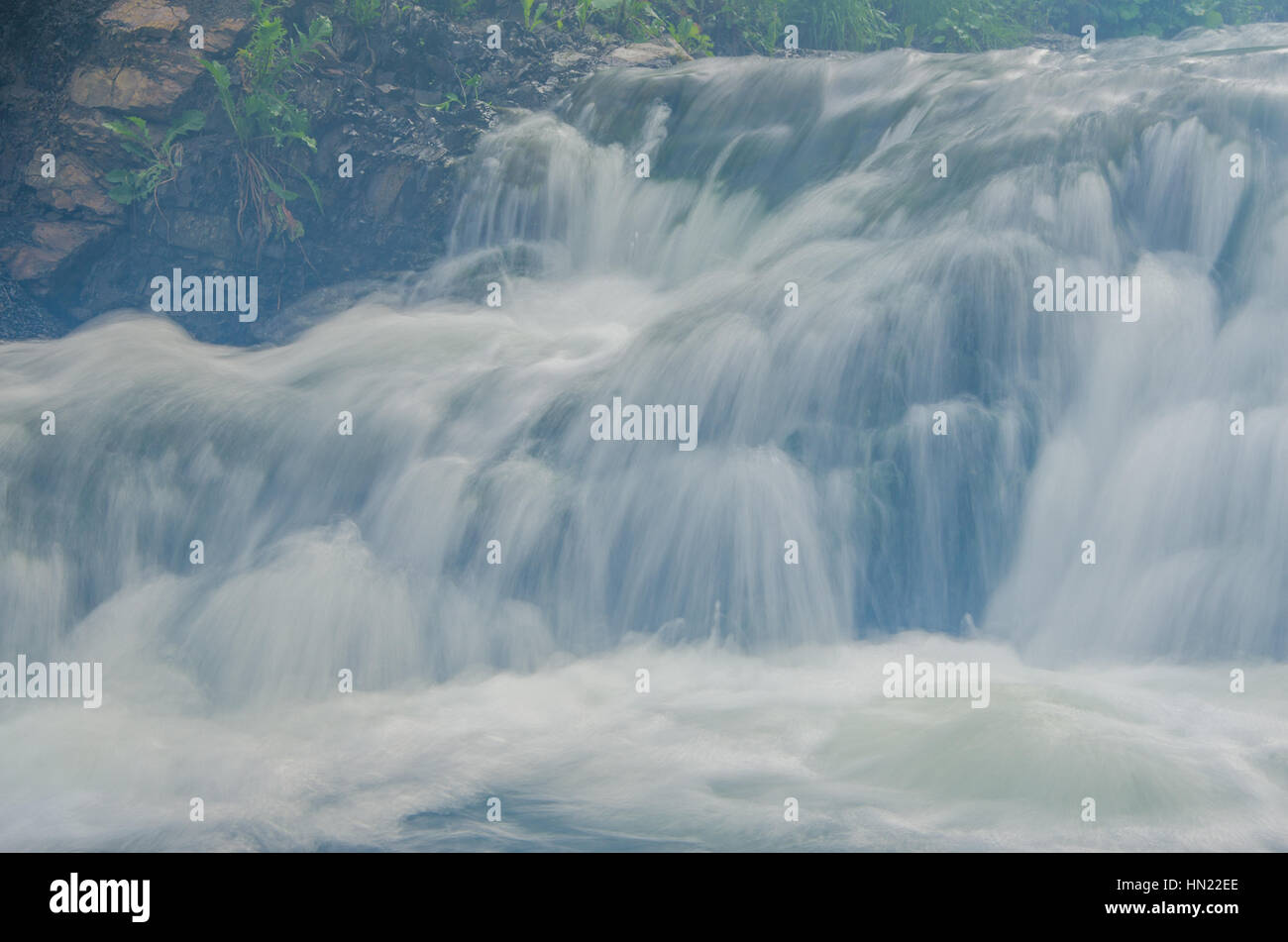 falling water in the morning mist. falling water in the dense morning ...