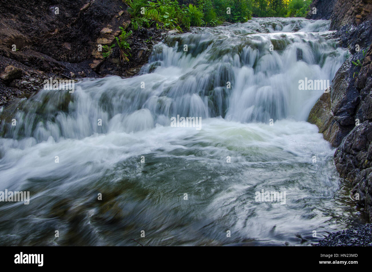 falling water in the morning mist. falling water in the dense morning ...