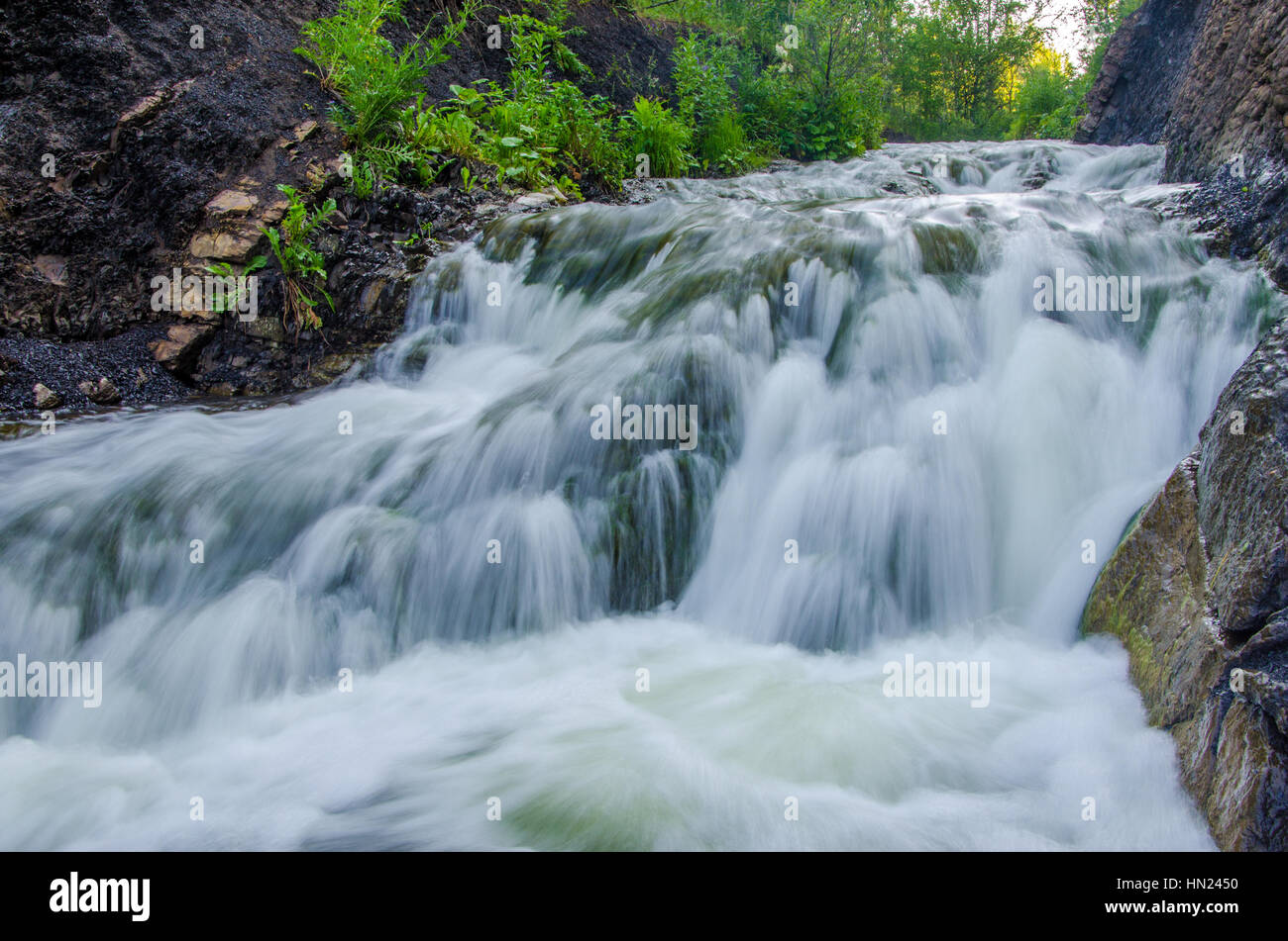 falling water in the morning mist. falling water in the dense morning ...