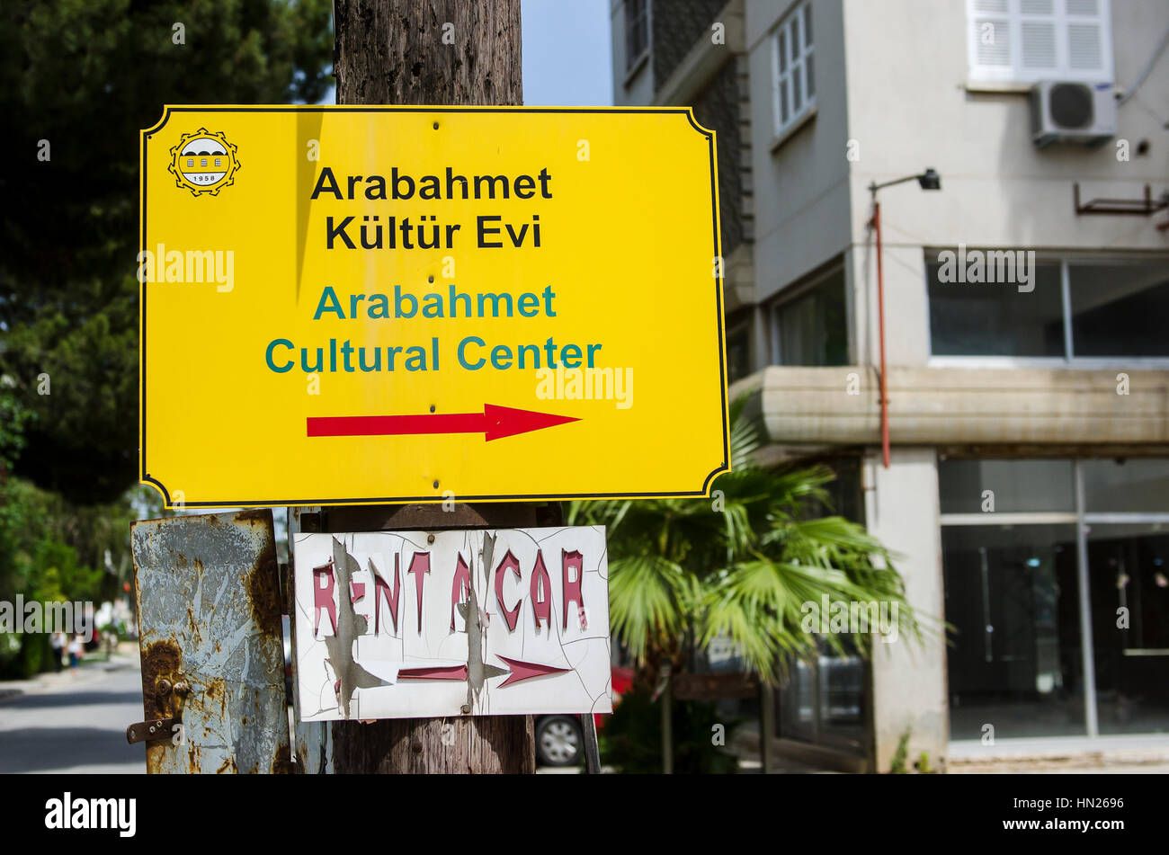 Signs on a wooden post on a street in Nicosia, Cyprus Stock Photo - Alamy