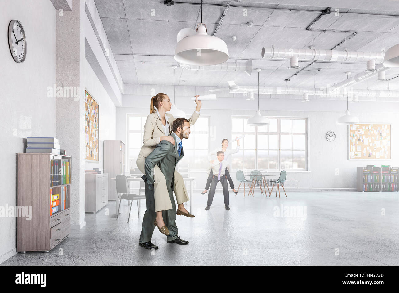 Businesspeople in office riding colleague back. Mixed media Stock Photo ...