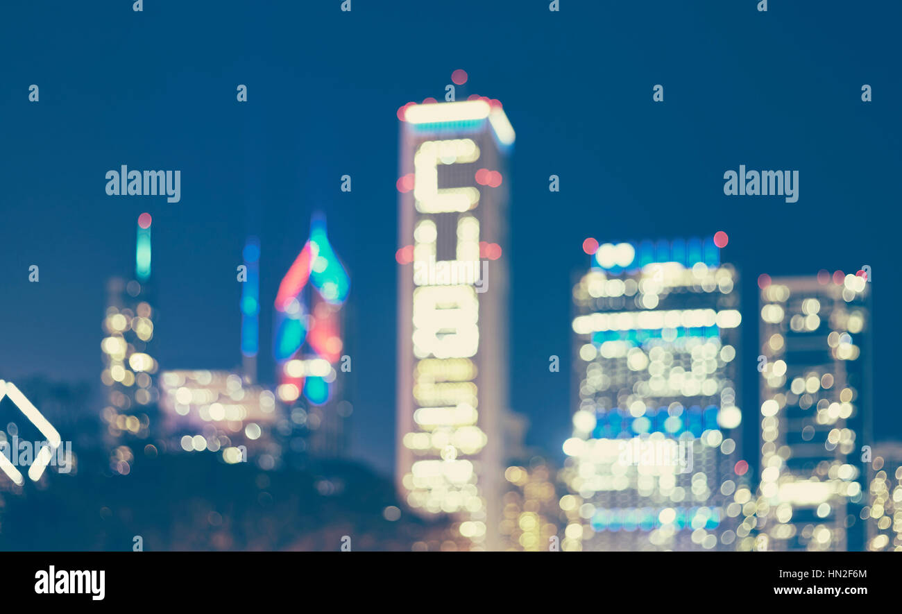 Color toned blurred picture of Chicago downtown at night, abstract ...