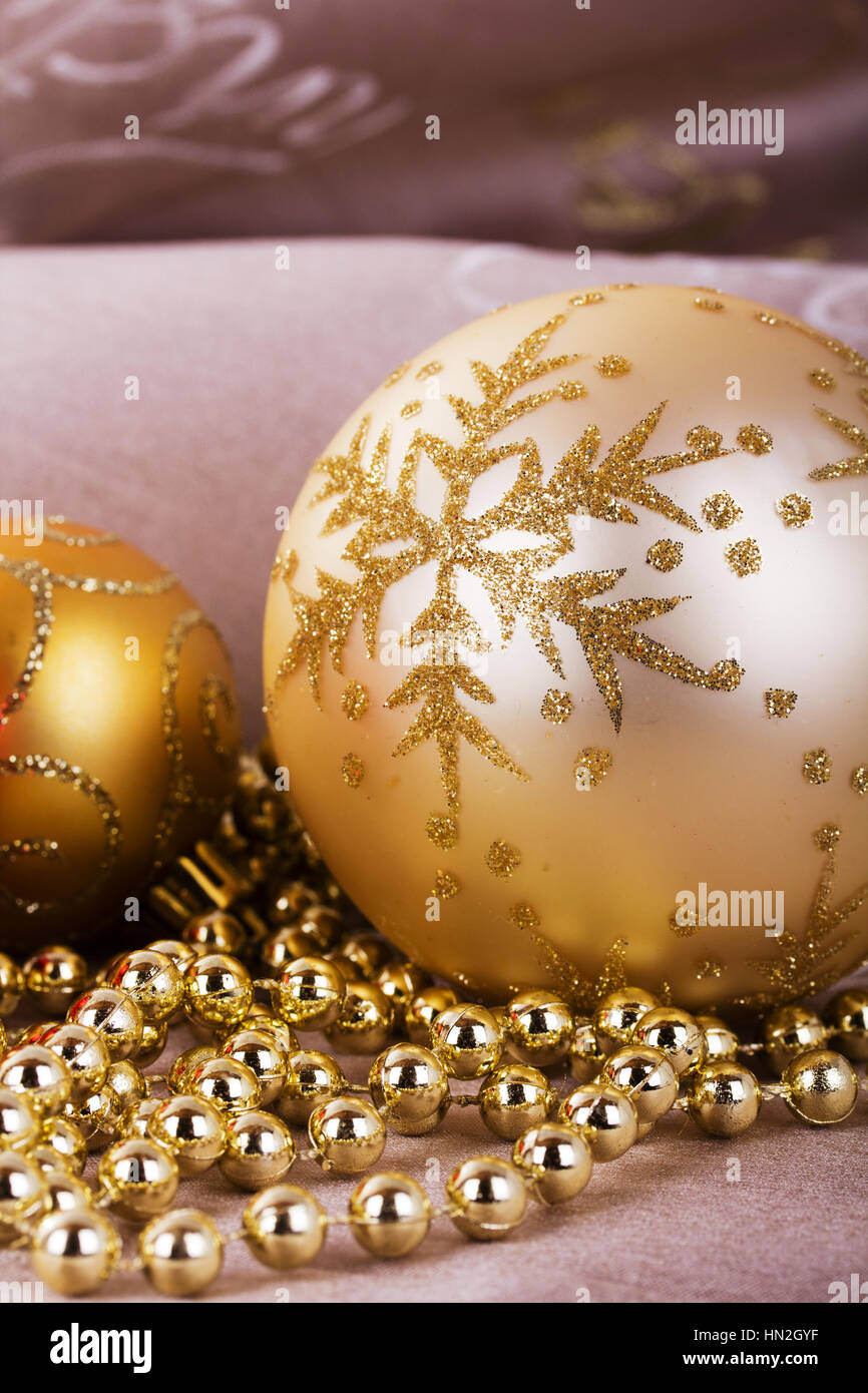 Festive gold Christmas decorations on a fabric background Stock Photo ...