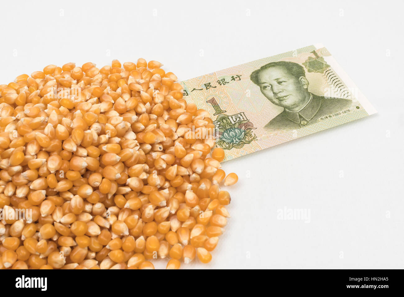 Chinese 1 Yuan / Renminbi banknote with pile for maize corn. Metaphor ...