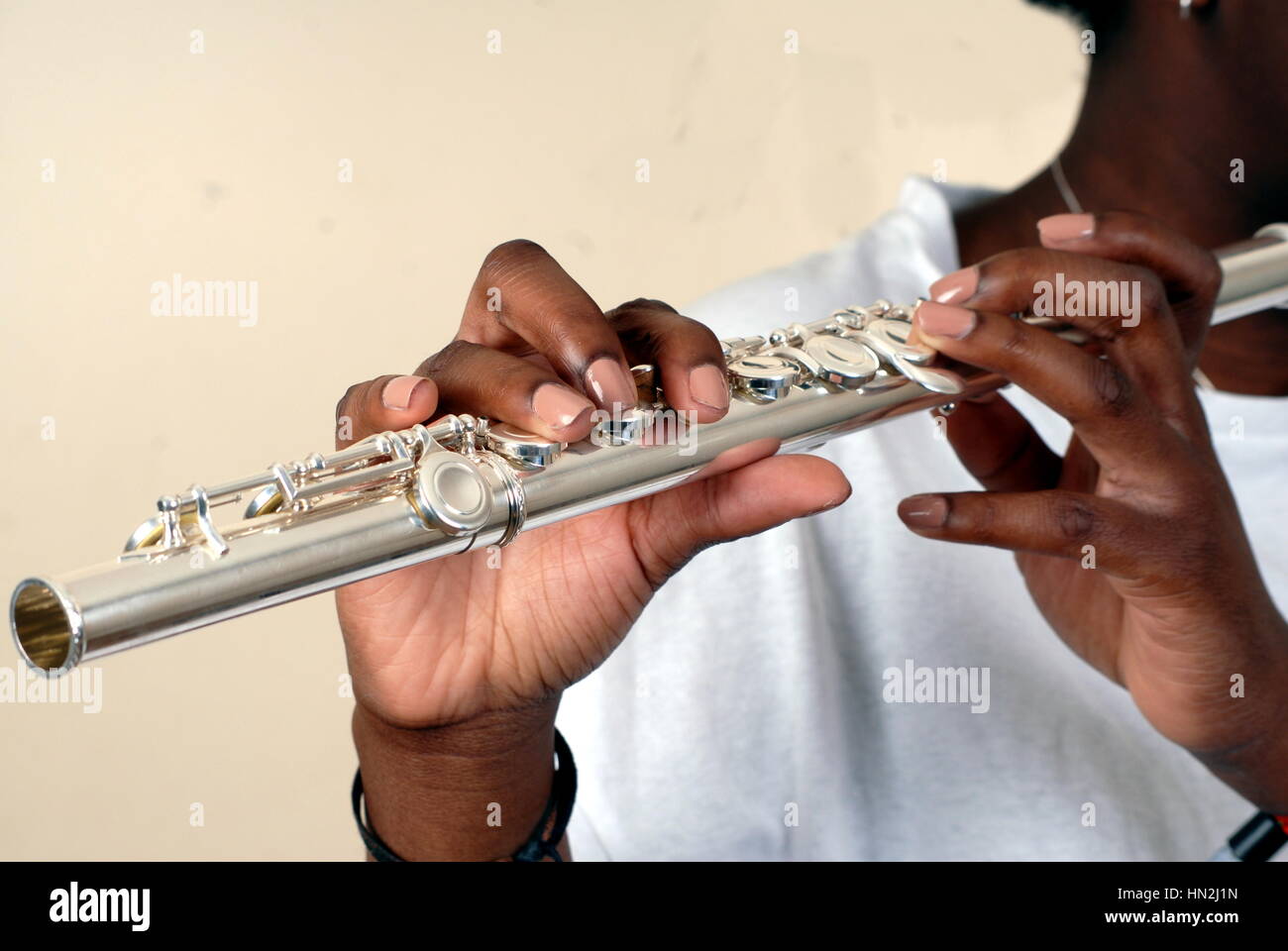 Young woman playing flute hi-res stock photography and images - Alamy