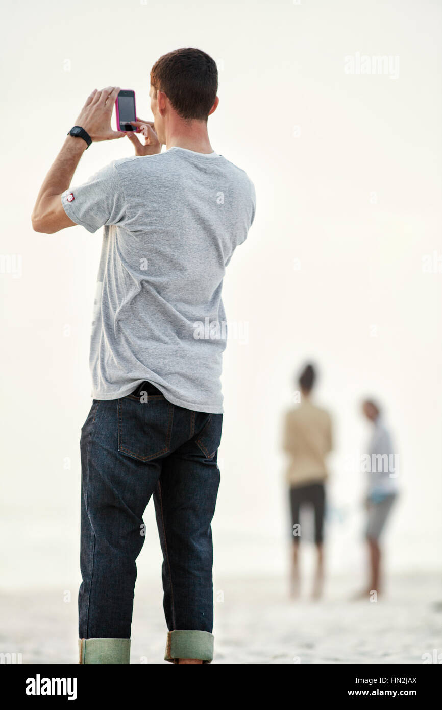Back View Of Man Taking Picture With Smartphone High Resolution Stock ...