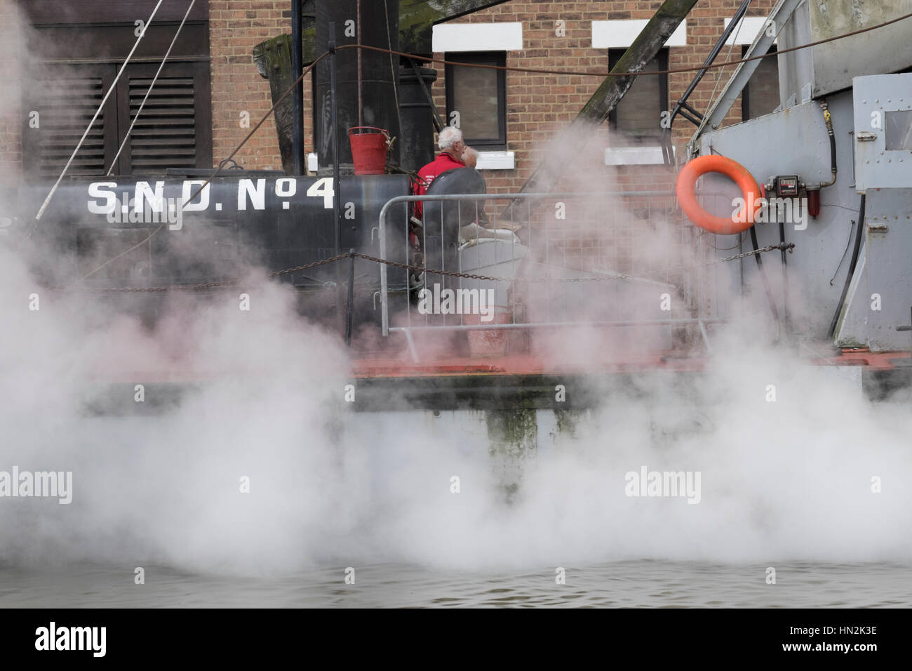 Volunteers working on a historic steam dredger in Gloucester Docks ...