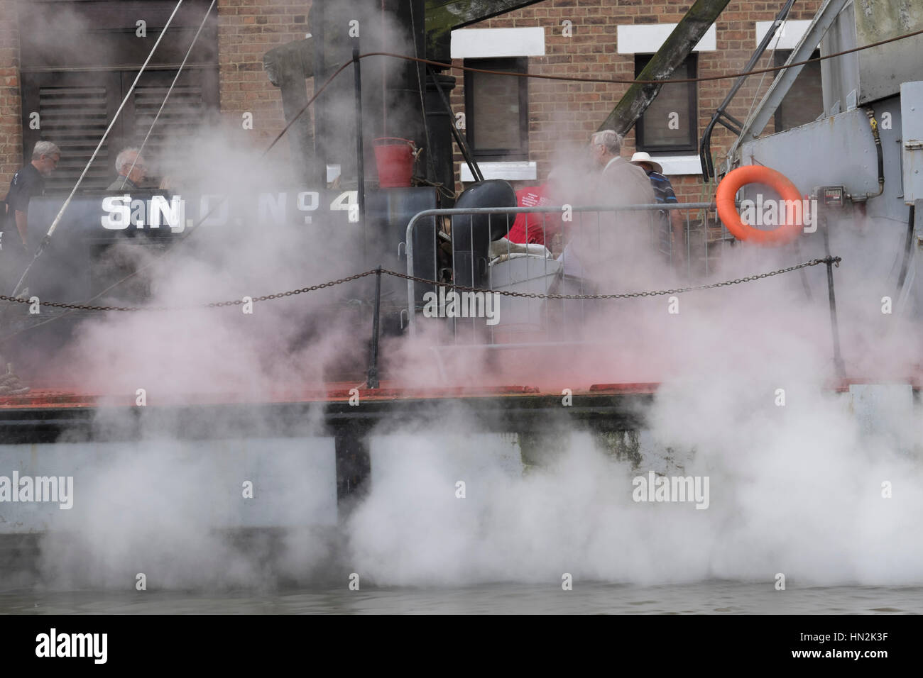 Volunteers working on a historic steam dredger in Gloucester Docks ...