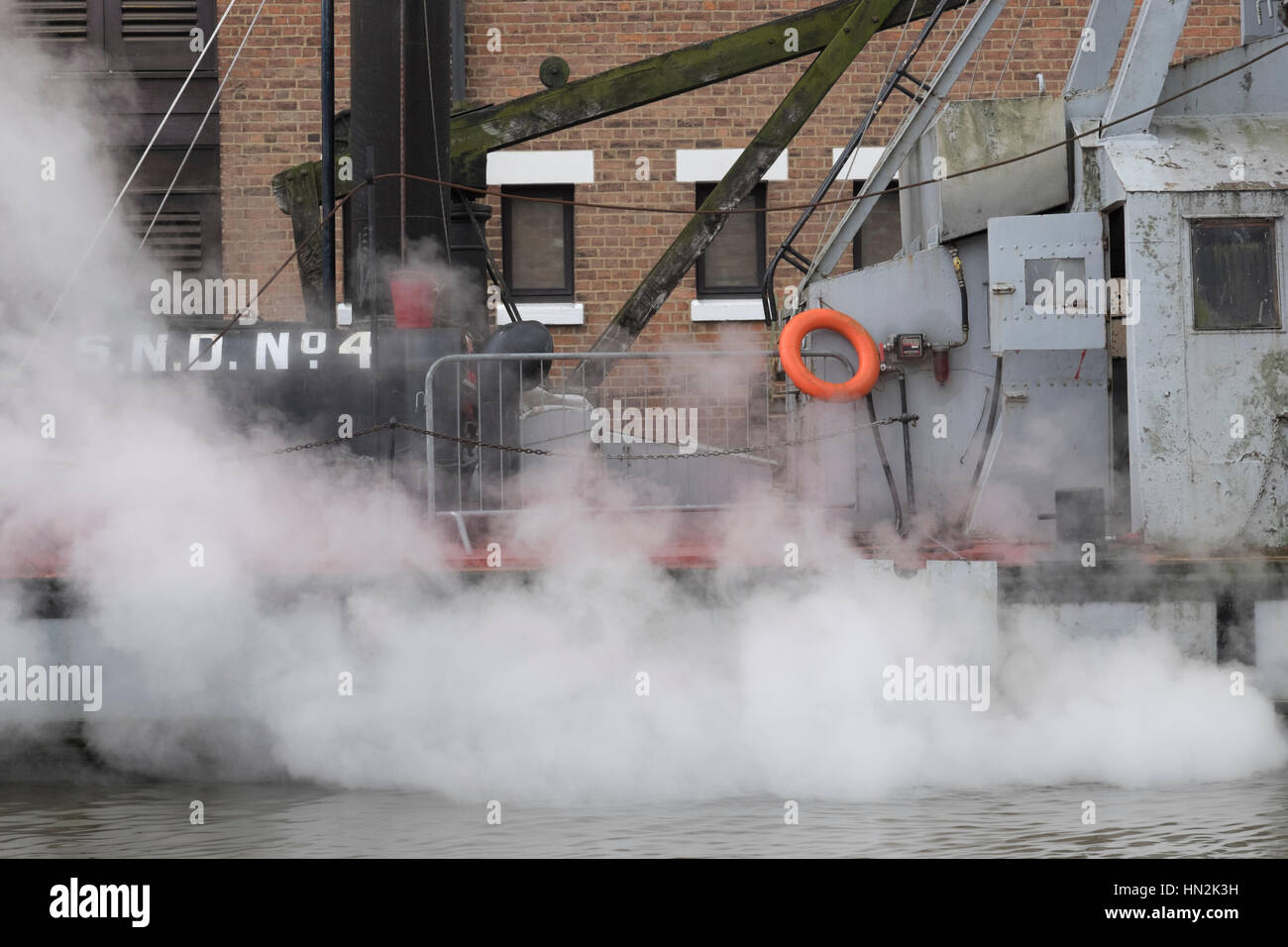 Volunteers working on a historic steam dredger in Gloucester Docks ...