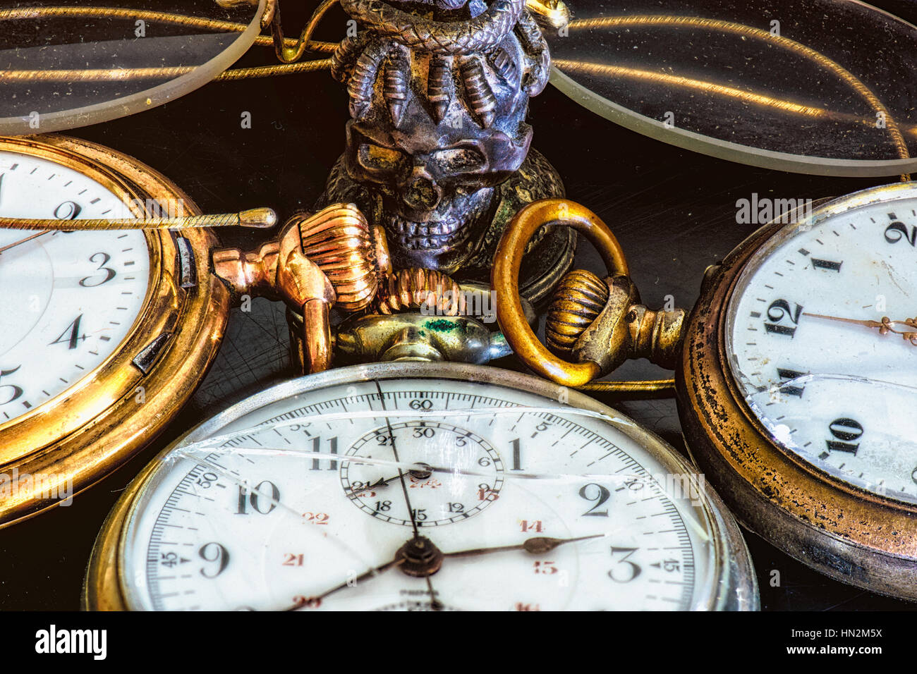 Color fine art still life macro of ancient golden watches,glasses,skull ...