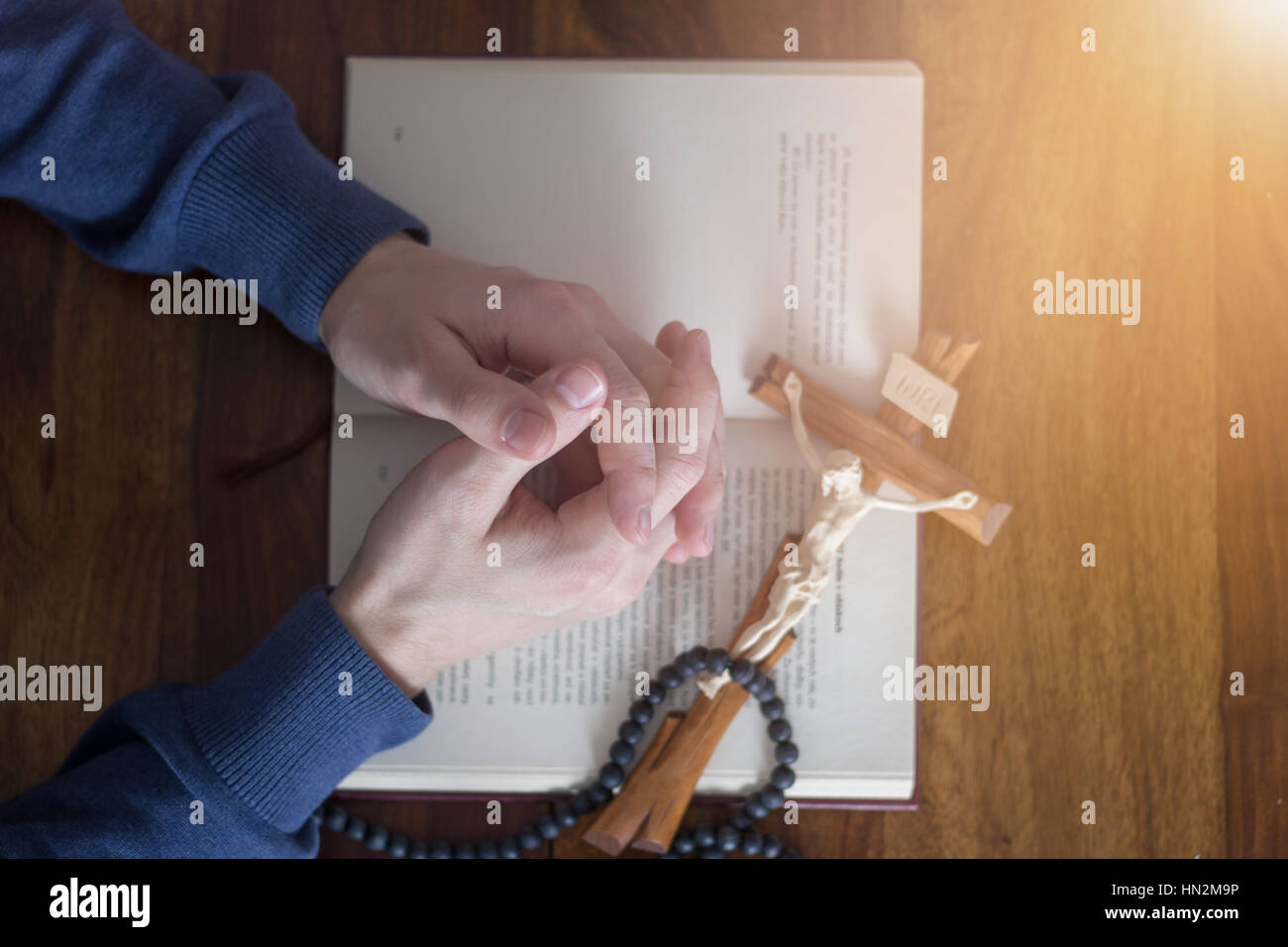 Person praying cross holy hi-res stock photography and images - Alamy