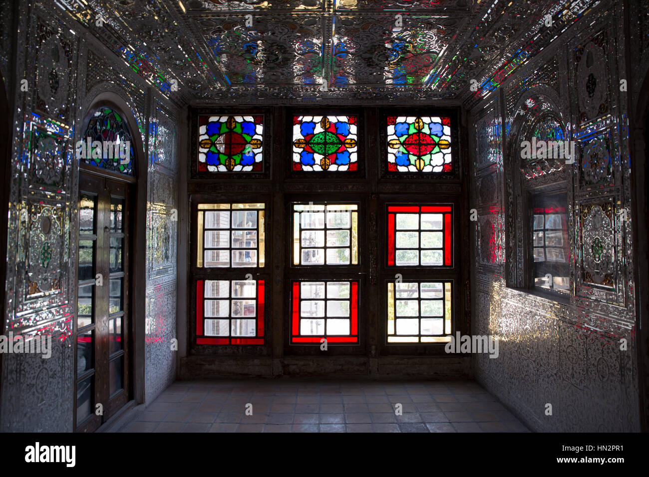 Interior with stained glass windows of the Zinat ol Molk Mansion ...