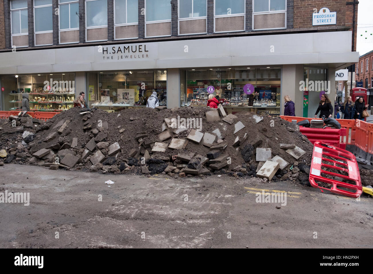 Roadworks rubble on high street Stock Photo - Alamy