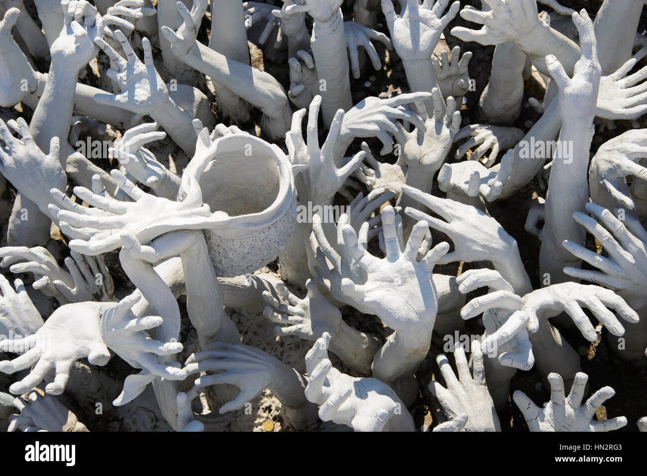 Hand from hell statue at wat rong khun hi-res stock photography and ...