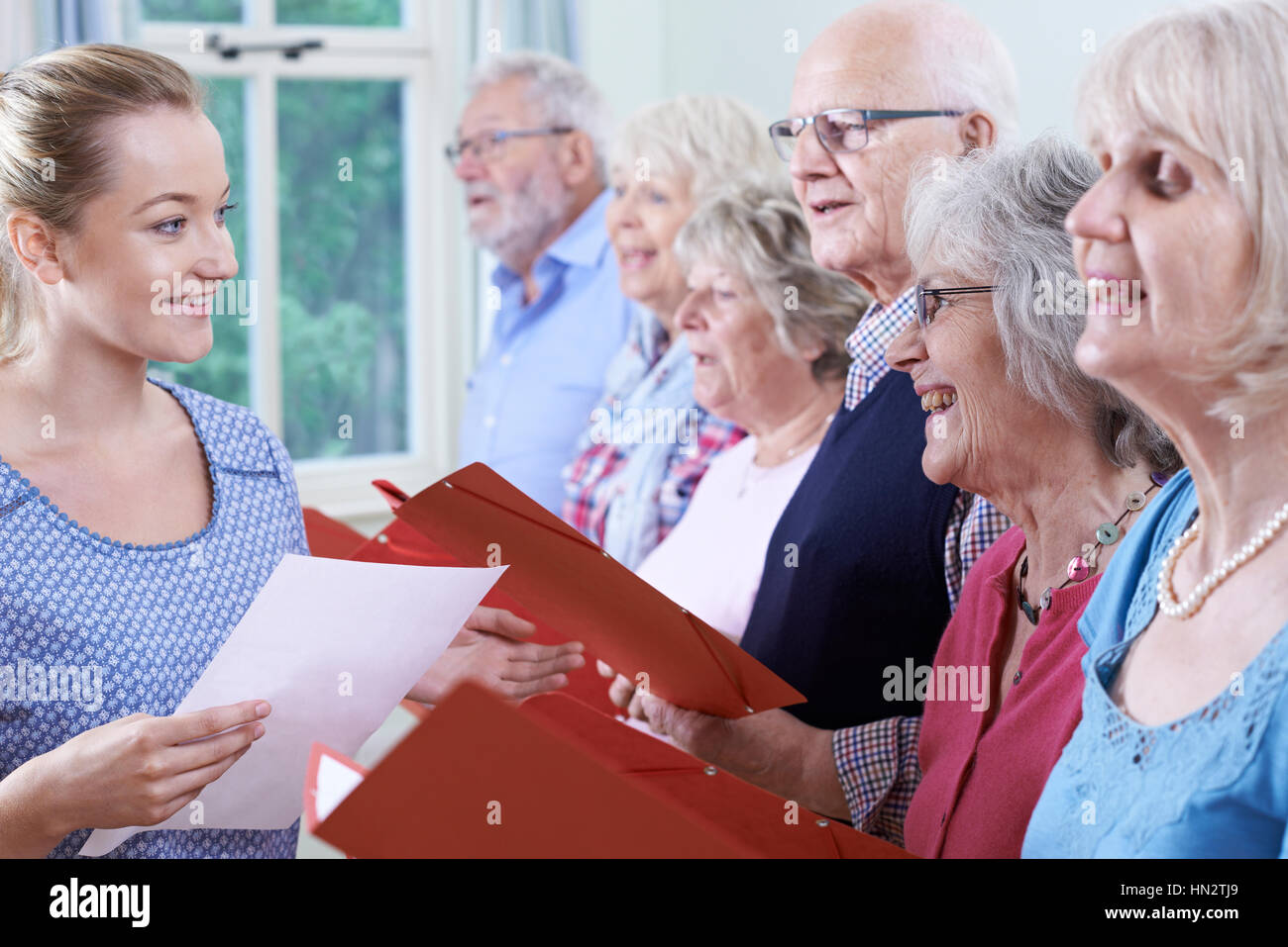 Group Of Seniors With Teacher Singing In Choir Together Stock Photo - Alamy