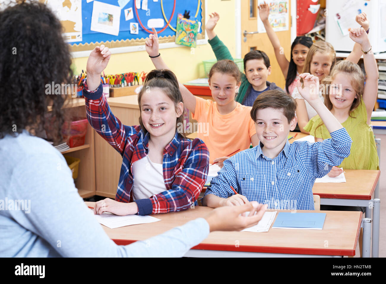 Hand raised in class hi-res stock photography and images - Alamy