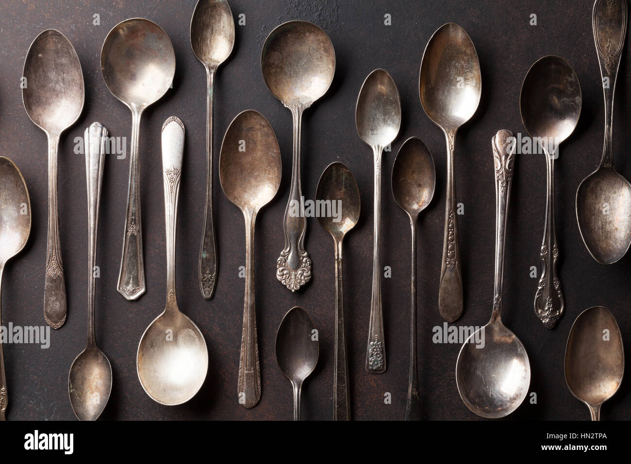 Old vintage spoons on stone table. Top view Stock Photo - Alamy