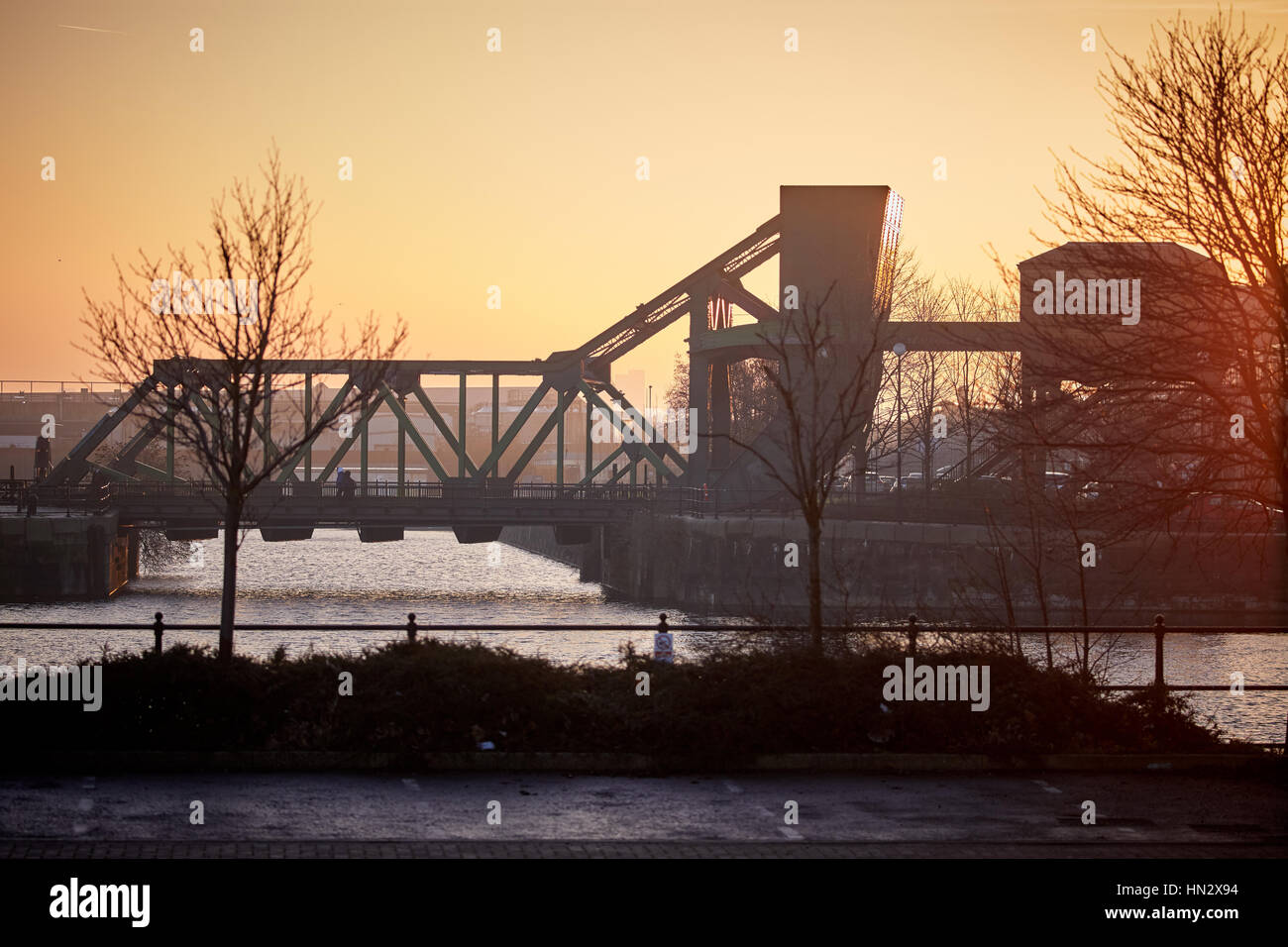 Golden orange sunrise at Birkenhead Egerton Docks bridge structure in ...