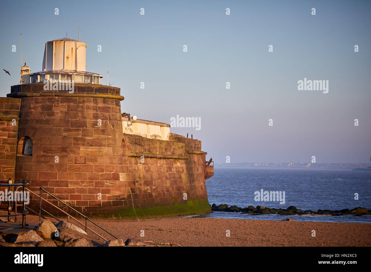 Liverpool bay Golden orange sunrise at New Brighton Fort Perch Rock and ...