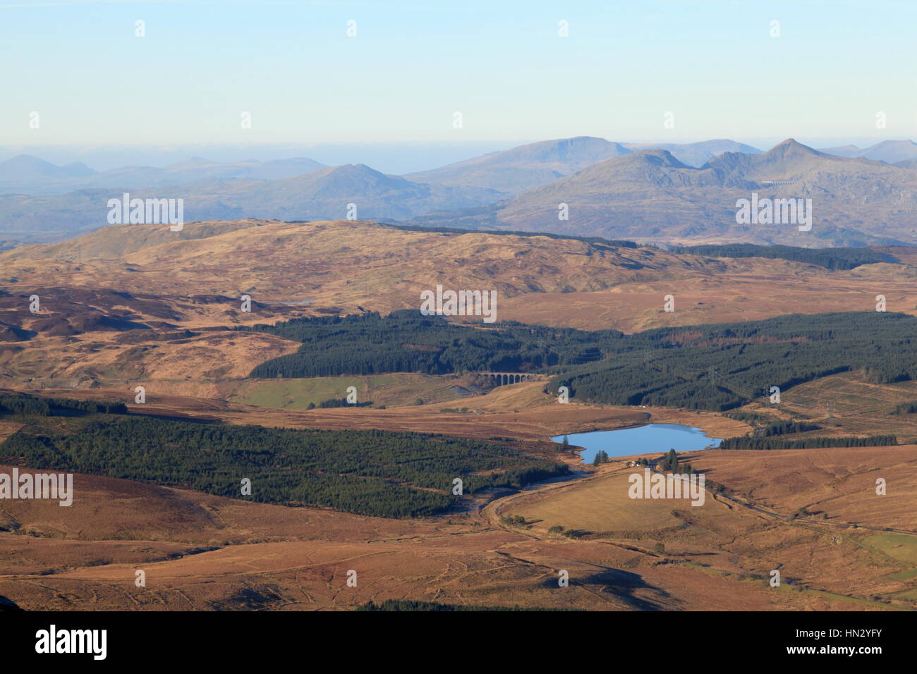 A hazy view of the Moelwyn mountains viewed from Arenig Fawr. The old ...