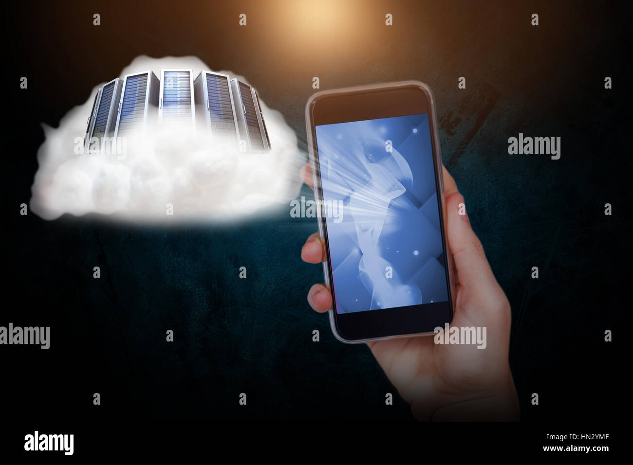 Hand holding mobile phone against against dark background Stock Photo ...