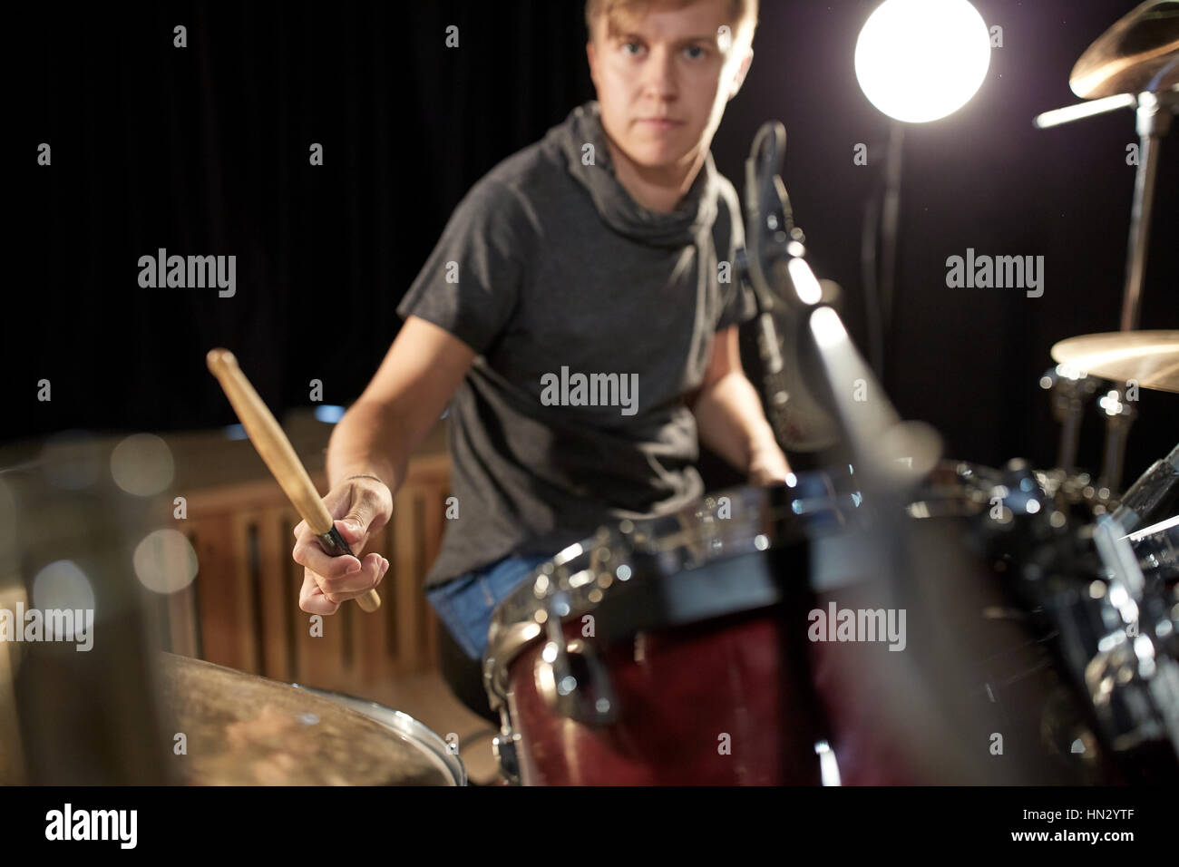 male musician playing drums and cymbals at concert Stock Photo - Alamy