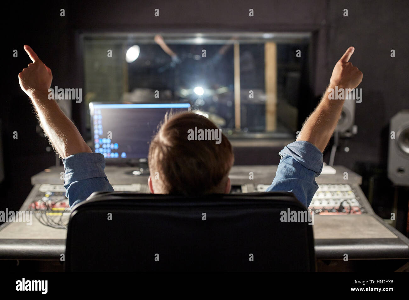 man at mixing console in music recording studio Stock Photo - Alamy
