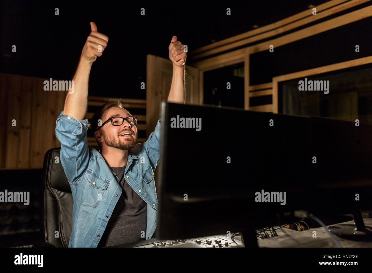 man at mixing console in music recording studio Stock Photo - Alamy