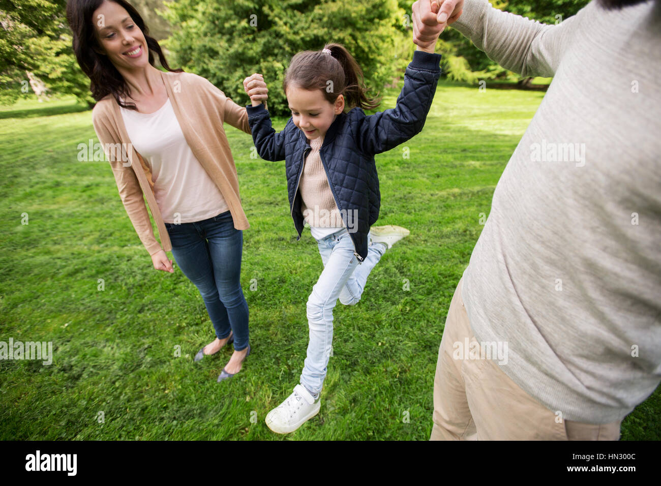 happy family walking in summer park and having fun Stock Photo - Alamy