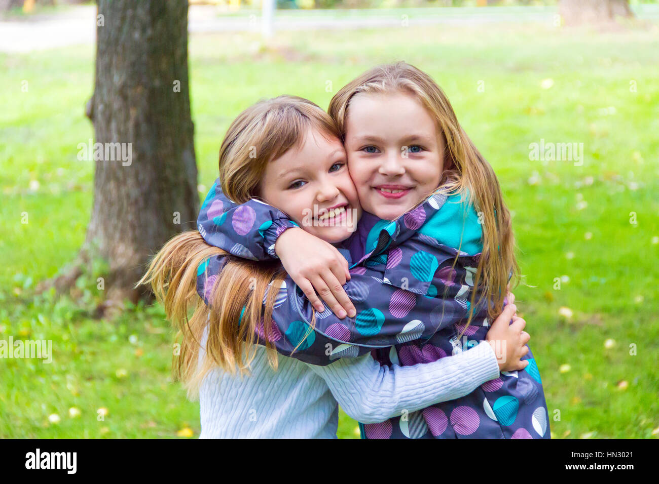 Photo of two playing girls in summer Stock Photo - Alamy