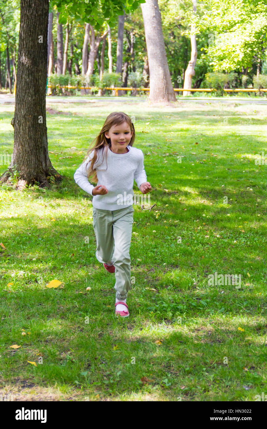 Photo of cute running girl in summer Stock Photo - Alamy