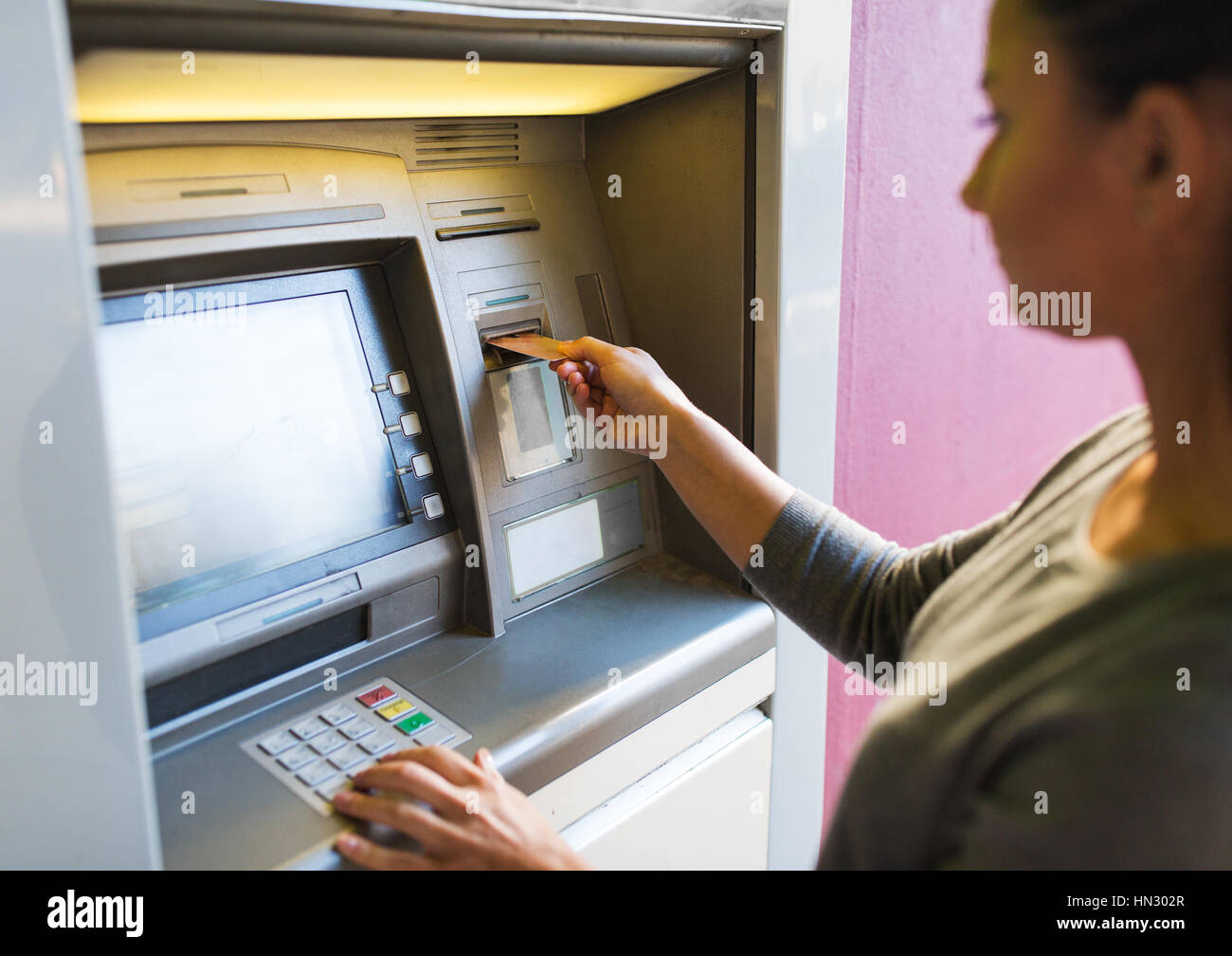 Inserting debit card bank atm hi-res stock photography and images - Alamy
