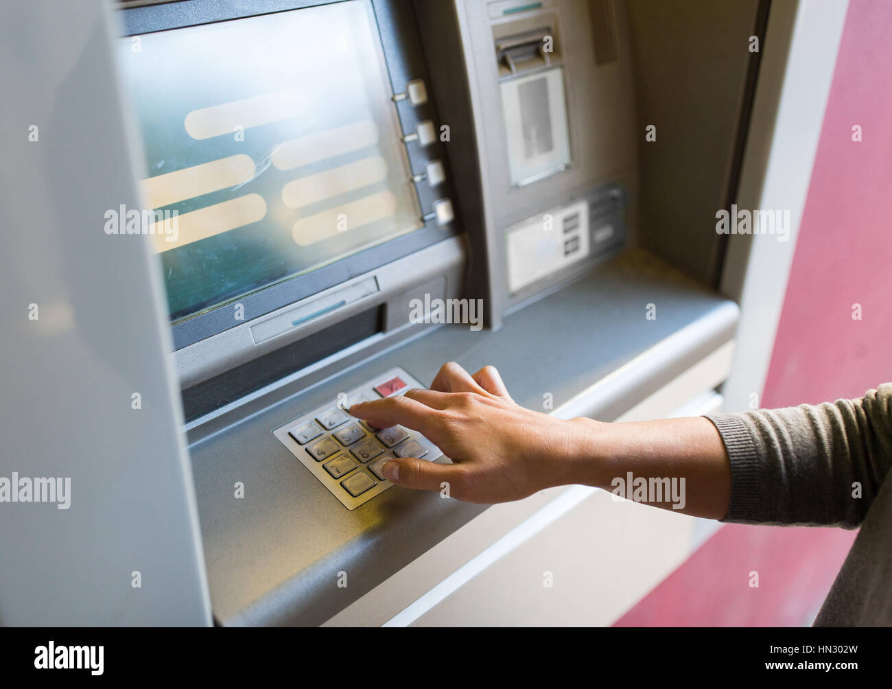 close up of hand entering pin code at atm machine Stock Photo - Alamy