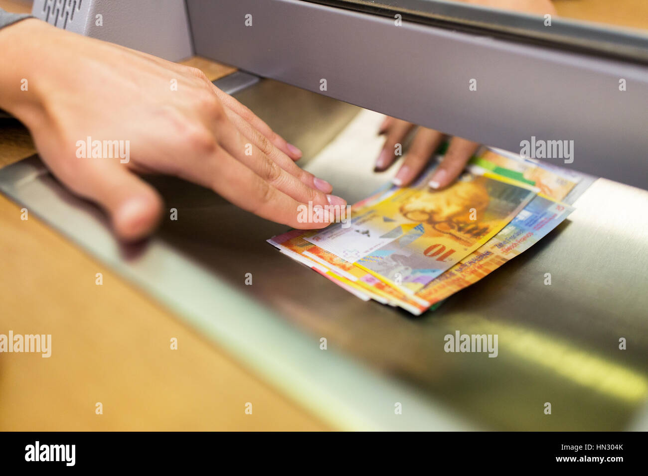 clerk giving cash money to customer at bank office Stock Photo - Alamy
