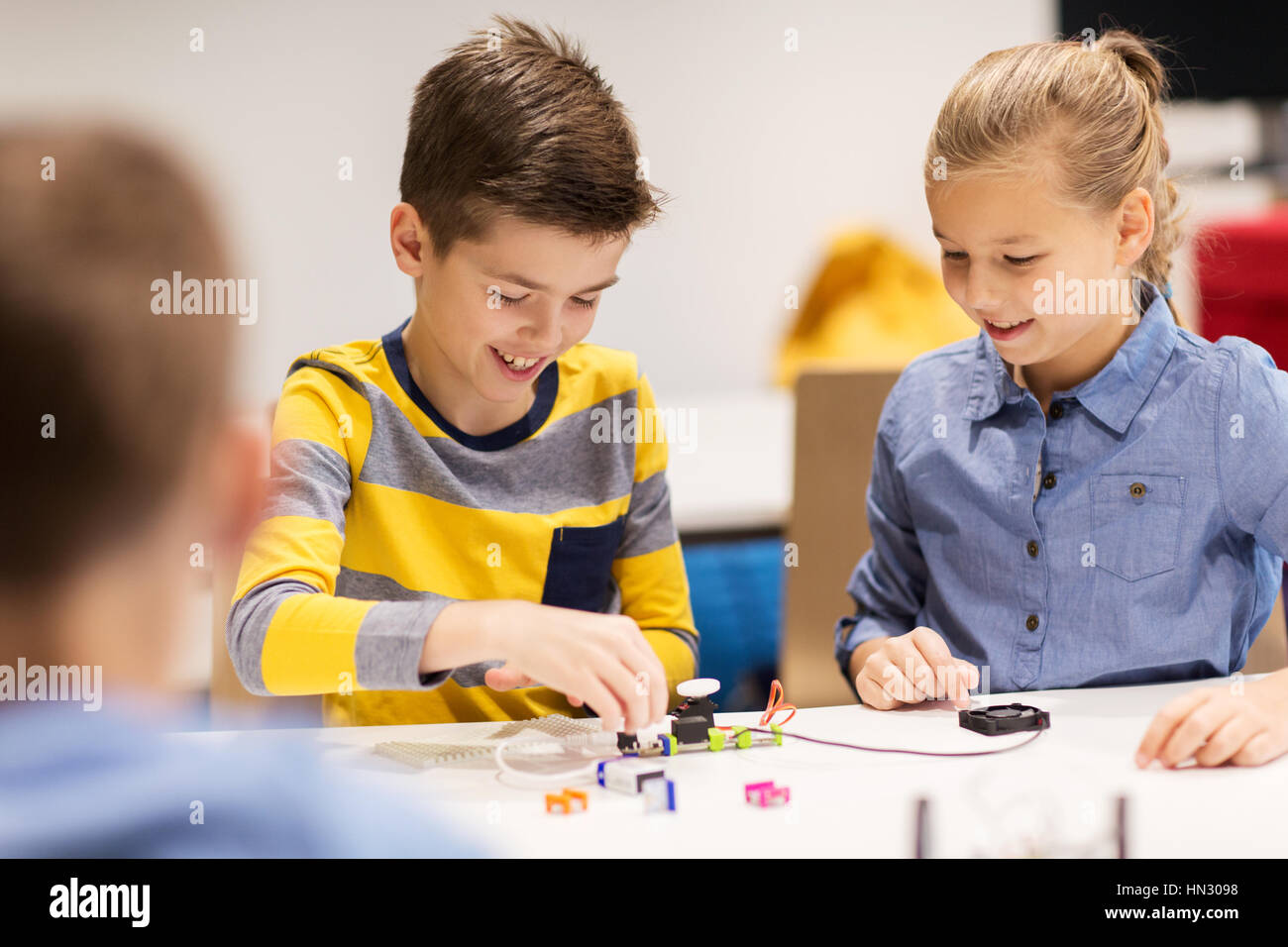 happy children building robots at robotics school Stock Photo - Alamy