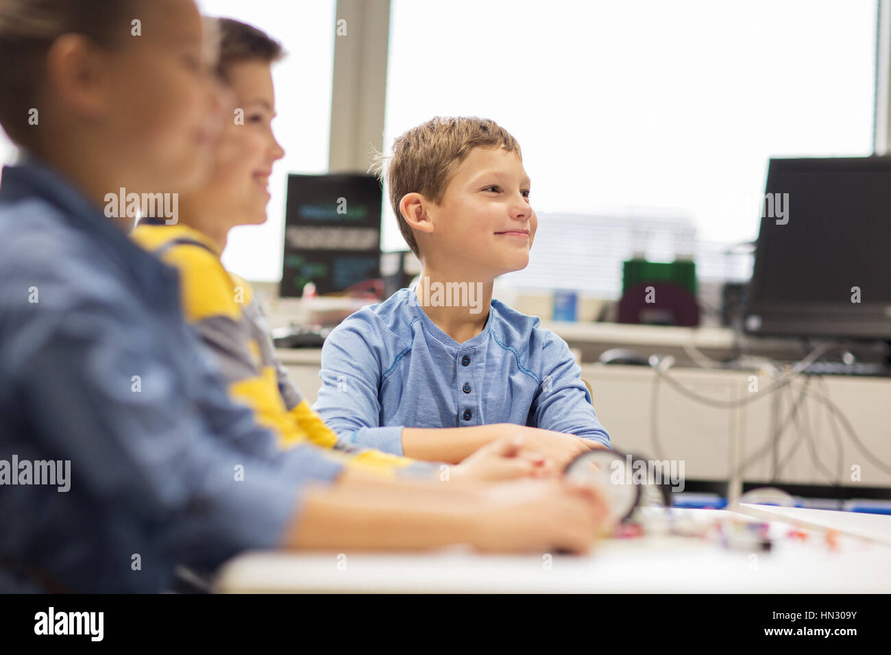 happy children building robots at robotics school Stock Photo - Alamy