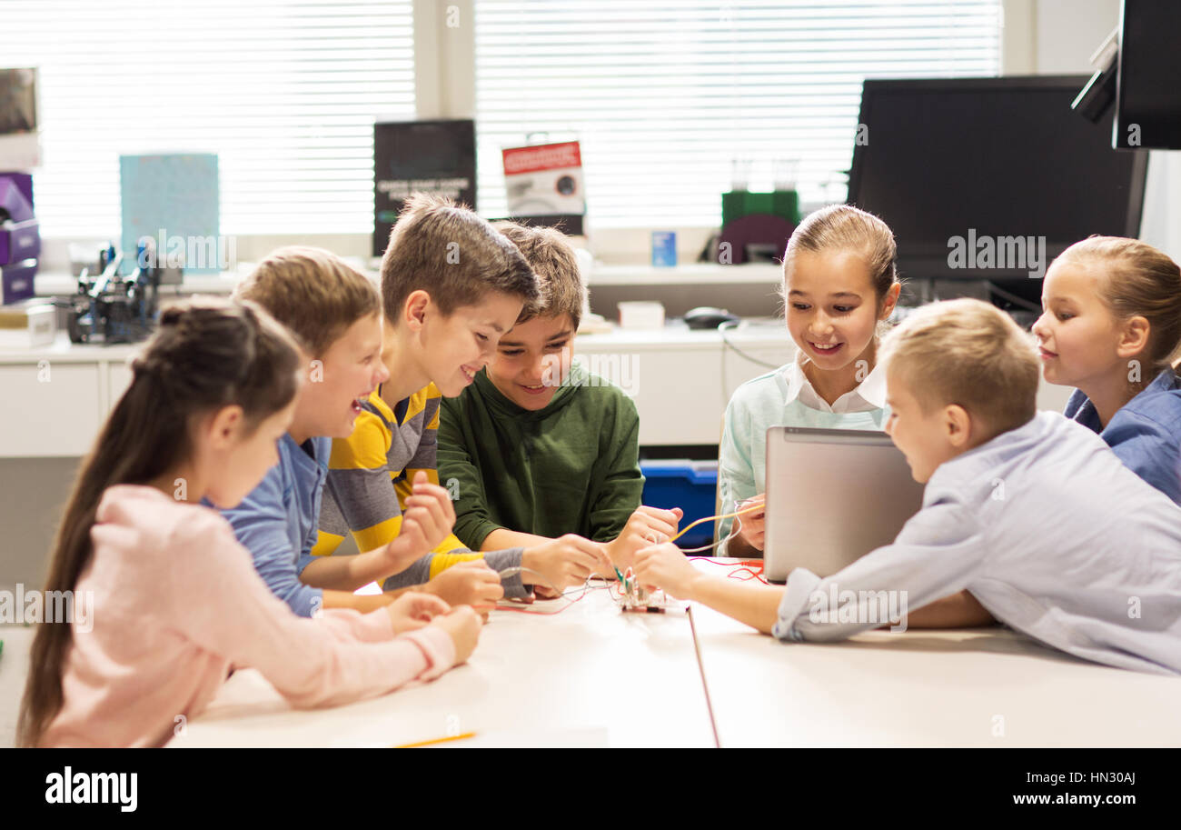 happy children with laptop at robotics school Stock Photo - Alamy