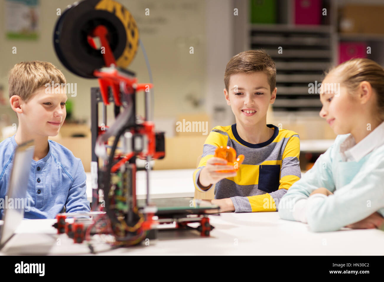 happy children with 3d printer at robotics school Stock Photo - Alamy