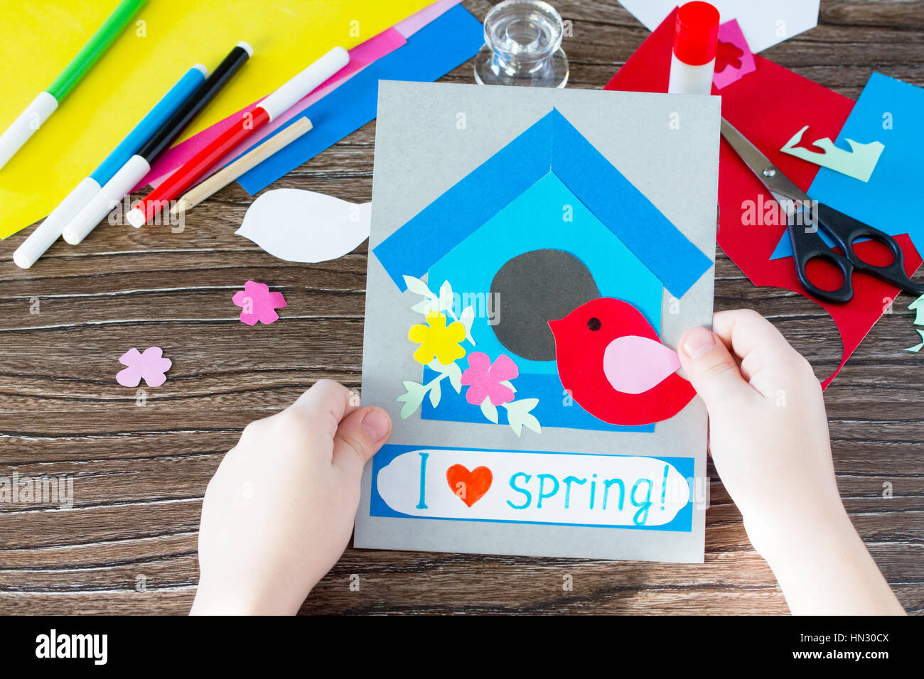 The child create a spring greeting card paper bird and birdhouse. Made ...