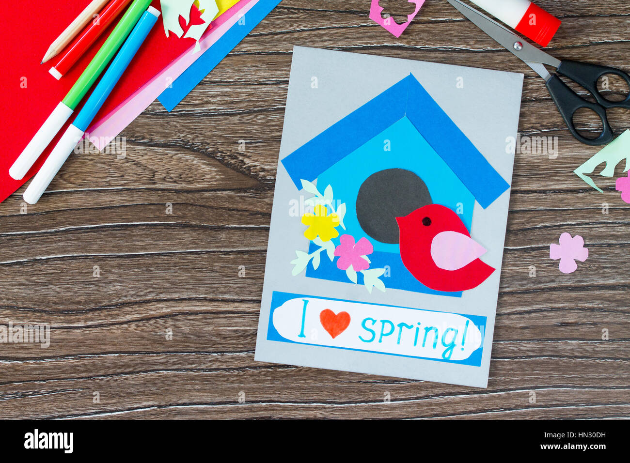 Children's spring greeting card paper bird and birdhouse with an ...