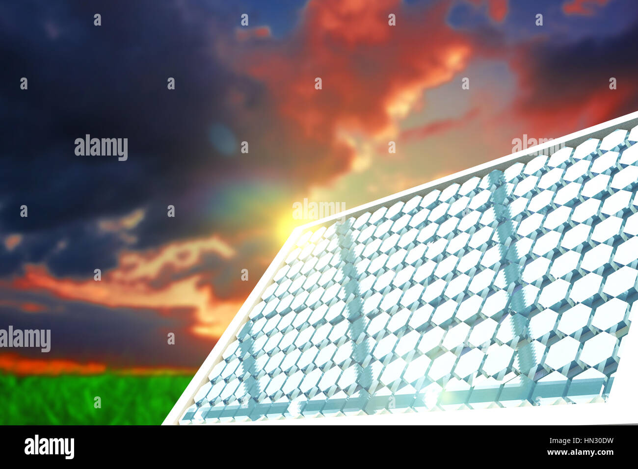 Solar panel with hexagon shape glasses against green grass under dark ...