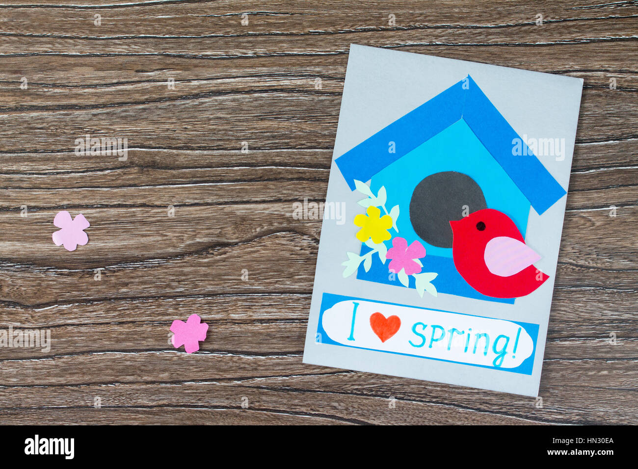 Children's spring greeting card paper bird and birdhouse with an ...