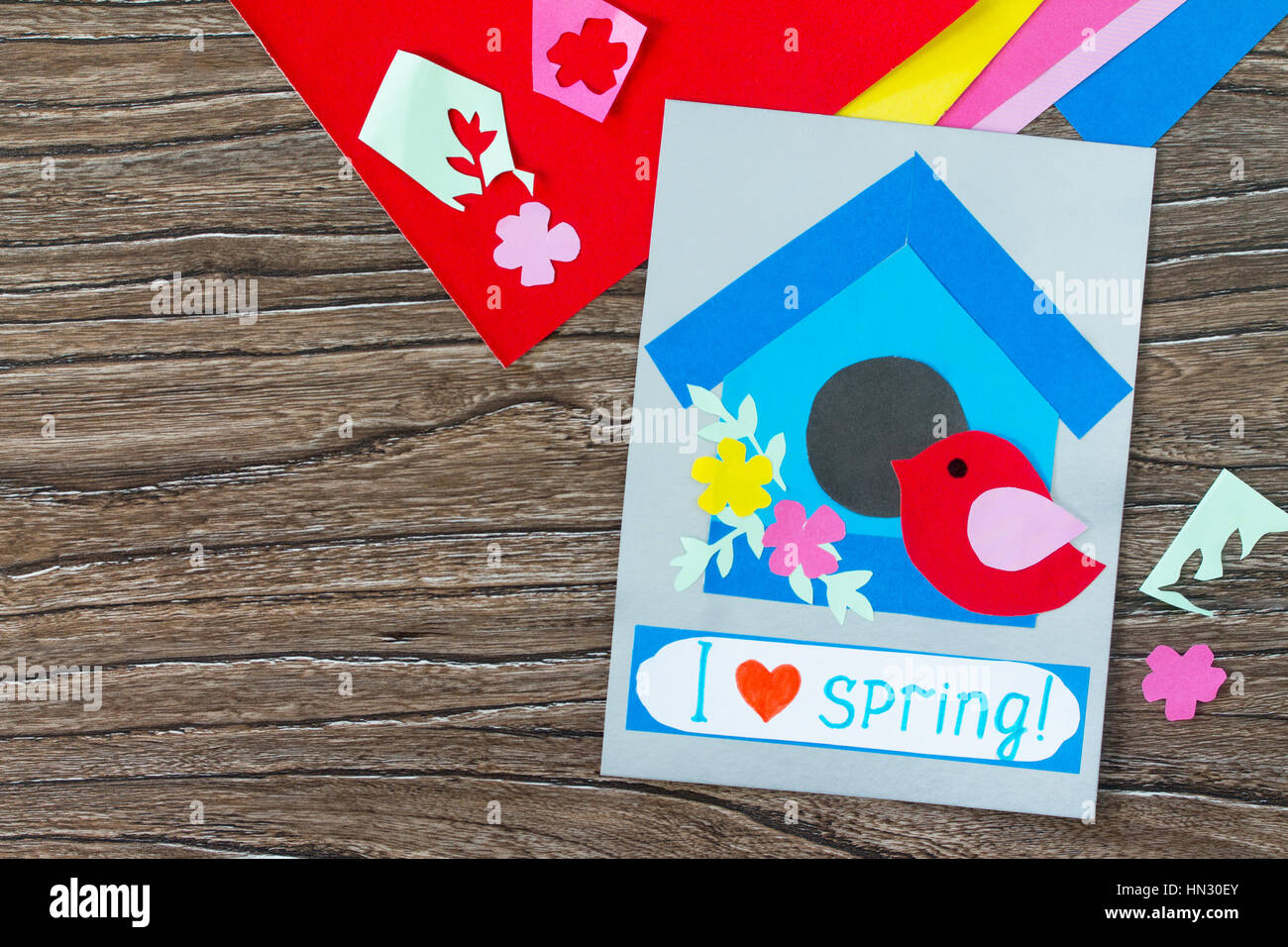 Children's spring greeting card paper bird and birdhouse with an ...