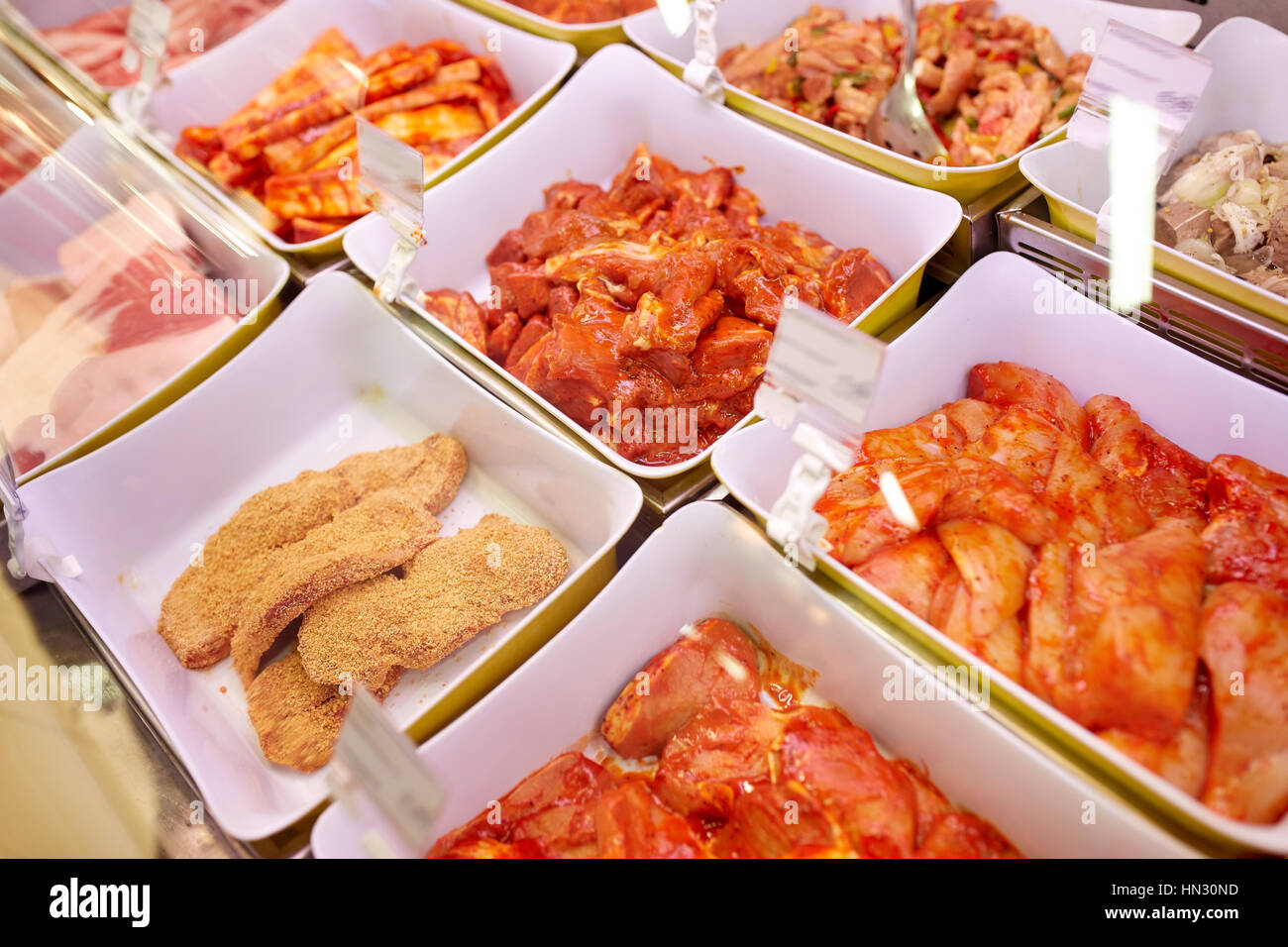 marinated meat in bowls at grocery stall Stock Photo - Alamy