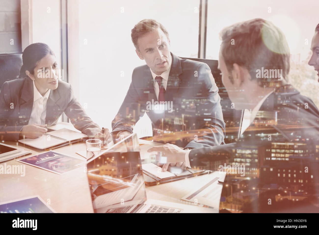 Business people interacting in conference room during meeting Stock ...