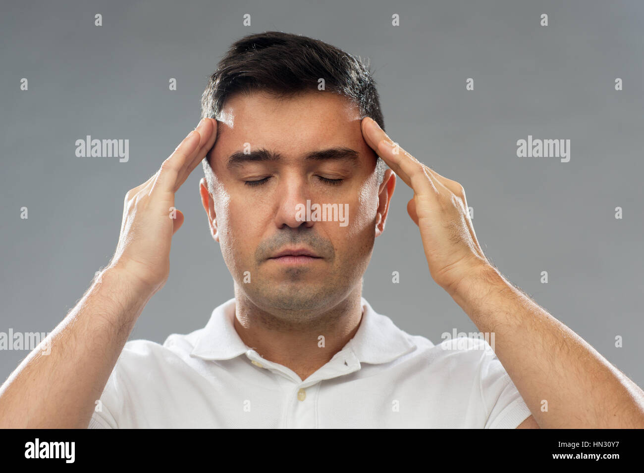 man suffering from head ache or thinking Stock Photo - Alamy