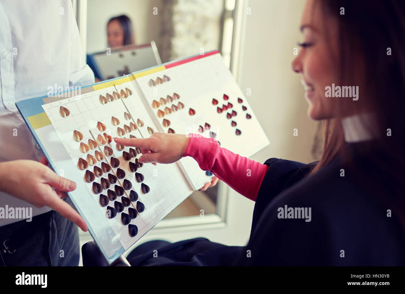 woman choosing hair color from palette at salon Stock Photo - Alamy