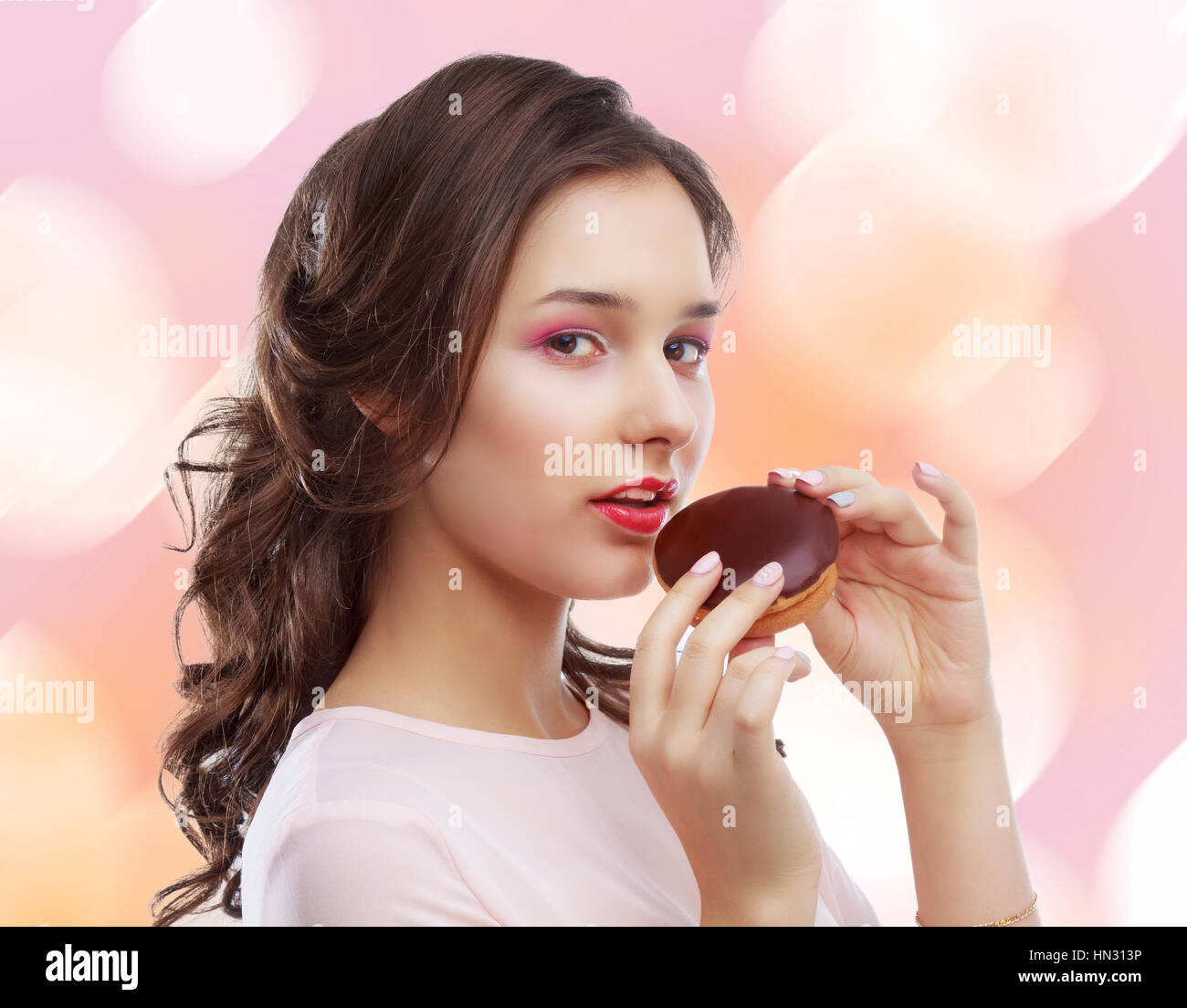 beautiful young model eating dessert, isolated Stock Photo - Alamy